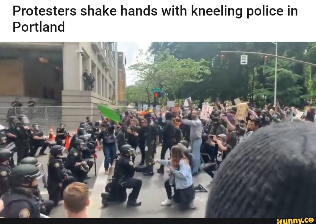 Protesters shake hands with kneeling police in Portland - iFunny