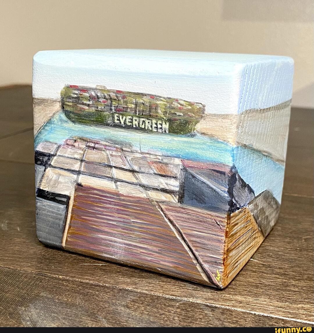 Cargo ship evergreen, blocking the Suez Canal, painted on a wood block ...