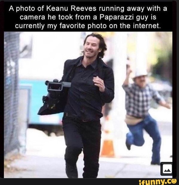 A photo of Keanu Reeves running away with a camera he took from a ...