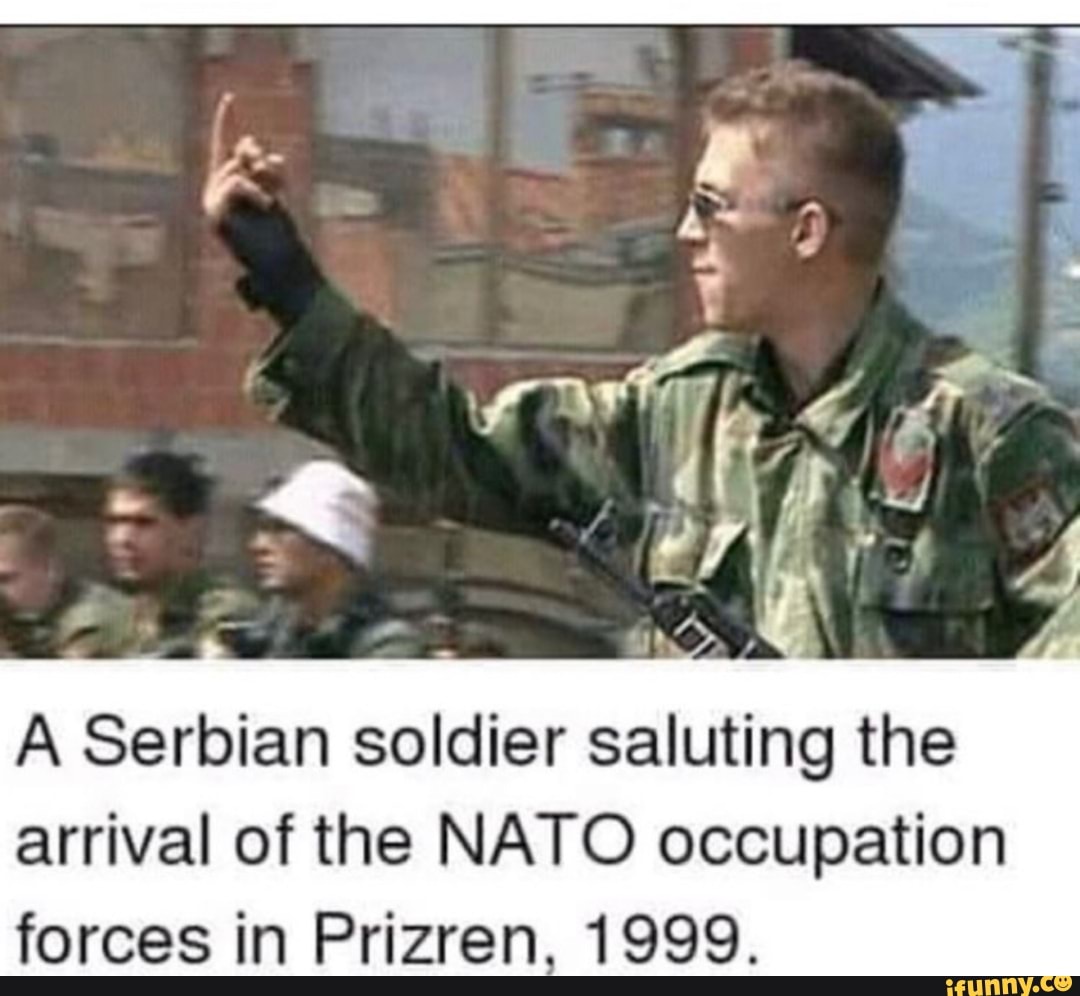 A Serbian soldier saluting the arrival of the NATO occupation forces in ...