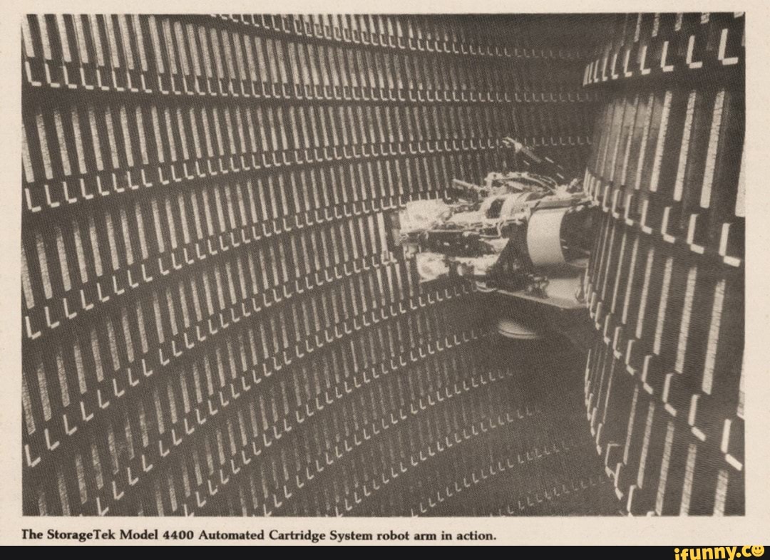 The StorageTek Model 4400 Automated Cartridge System robot arm in ...