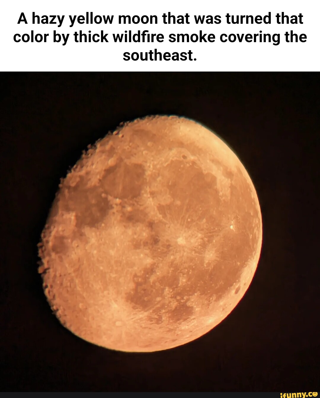 A hazy yellow moon that was turned that color by thick wildfire smoke ...