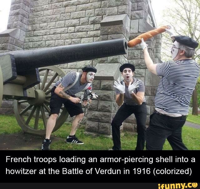 French troops loading an armor-piercing shell into a howitzer at the ...