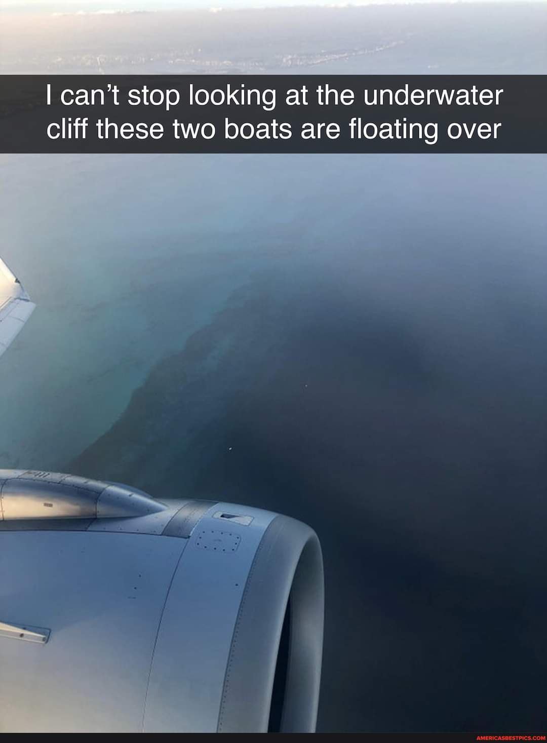 I can't stop looking at the underwater cliff these two boats are ...