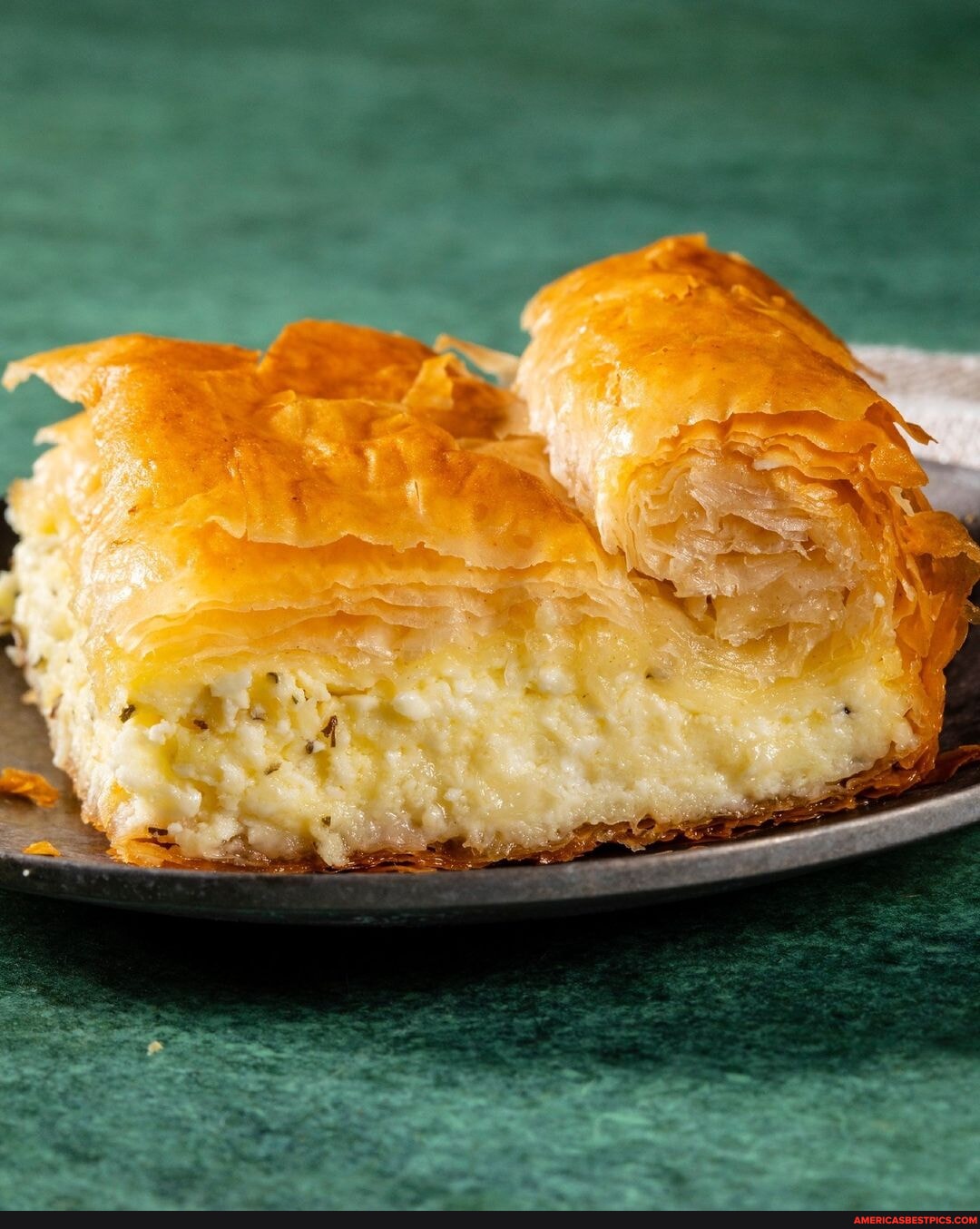 This savory Greek cheese pie is made with layers of butterbrushed ...