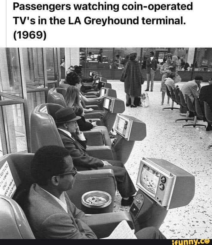 Passengers watching coin-operated TV's in the LA Greyhound terminal ...